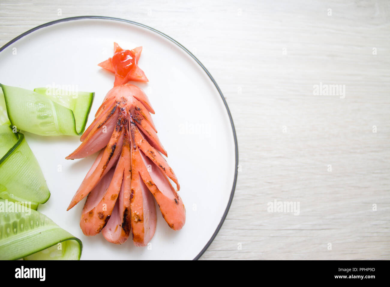 Funny edible Christmas tree made from fried grilled sausages, Breakfast ...
