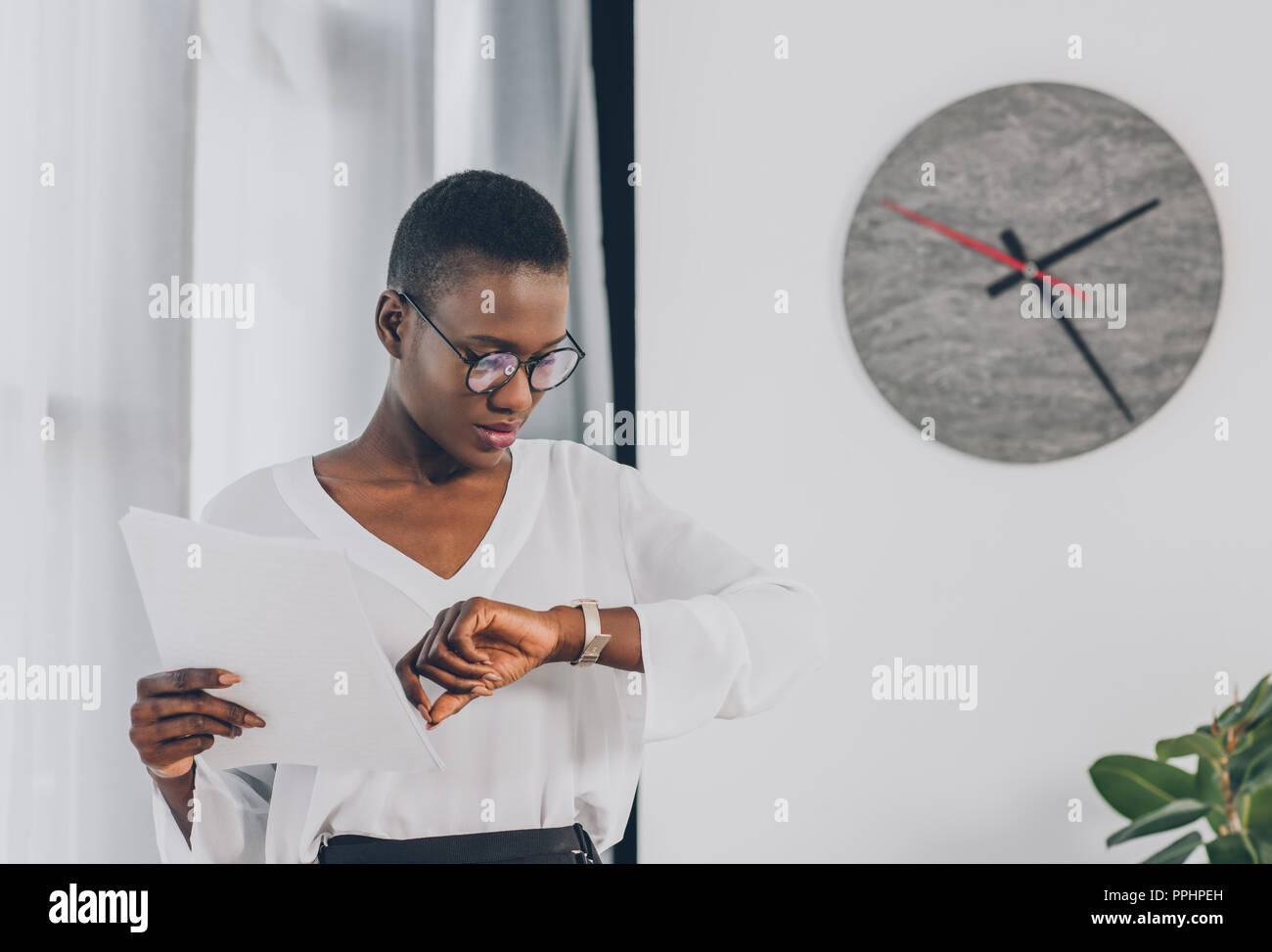 Checking time wall clock hi-res stock photography and images - Alamy