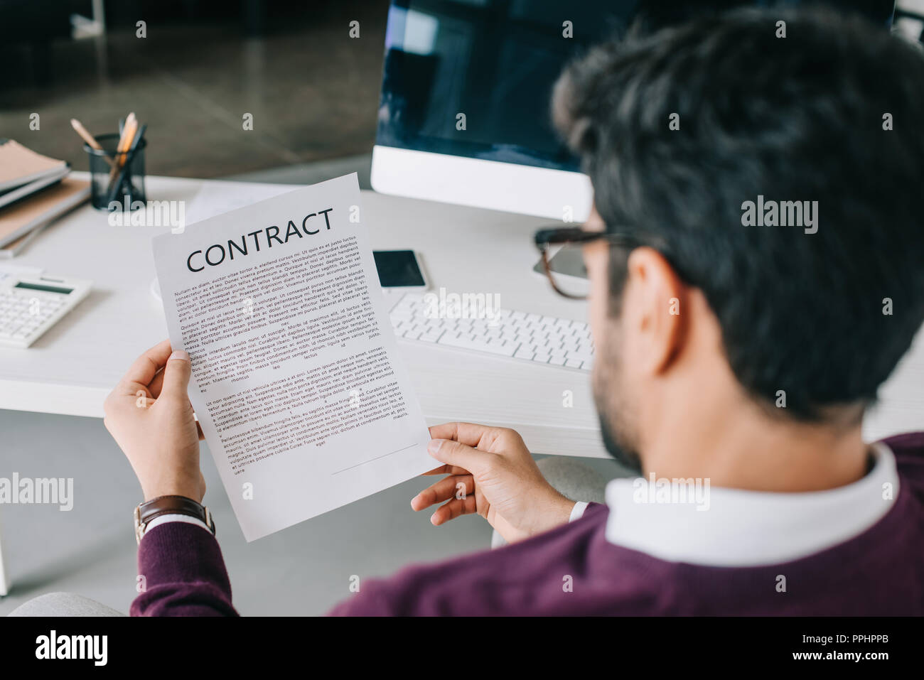 Businessman reading contract hi-res stock photography and images - Alamy