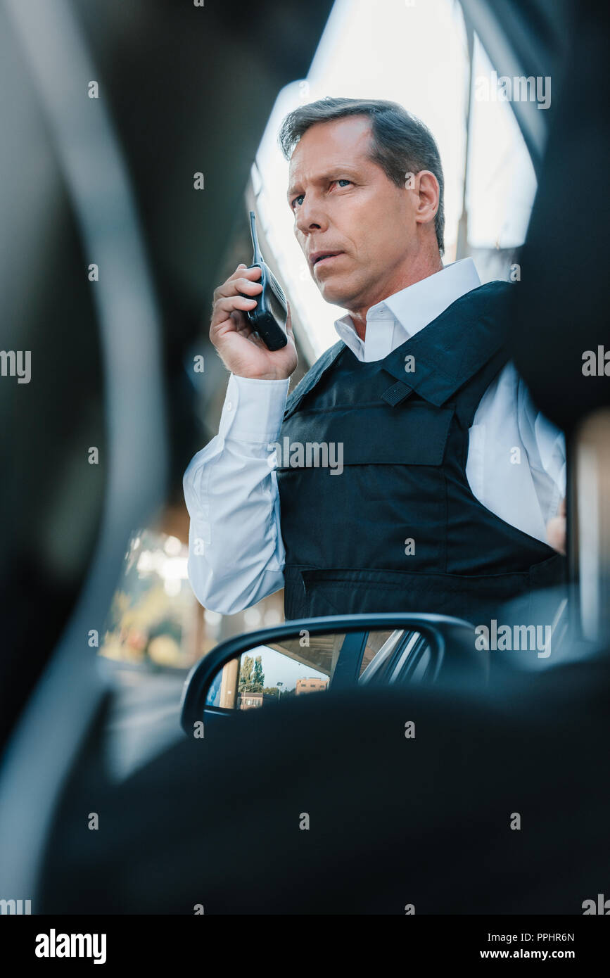 Policeman talking on radio communication hi-res stock photography and ...