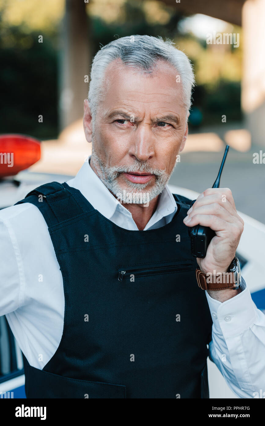 Policeman talking on radio communication hi-res stock photography and ...
