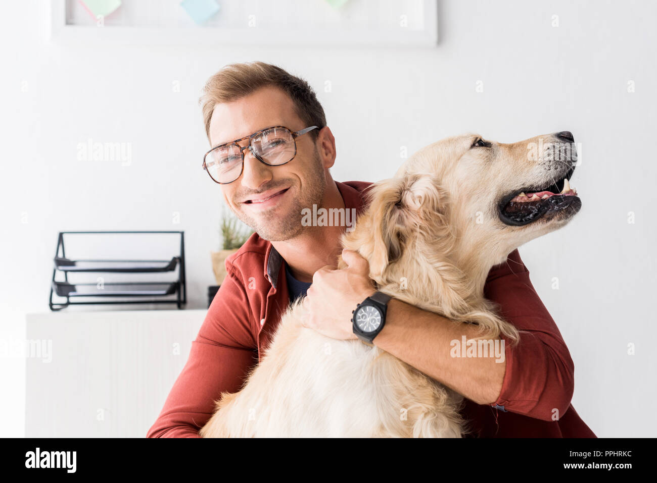Man hugging golden retriever hi-res stock photography and images - Alamy