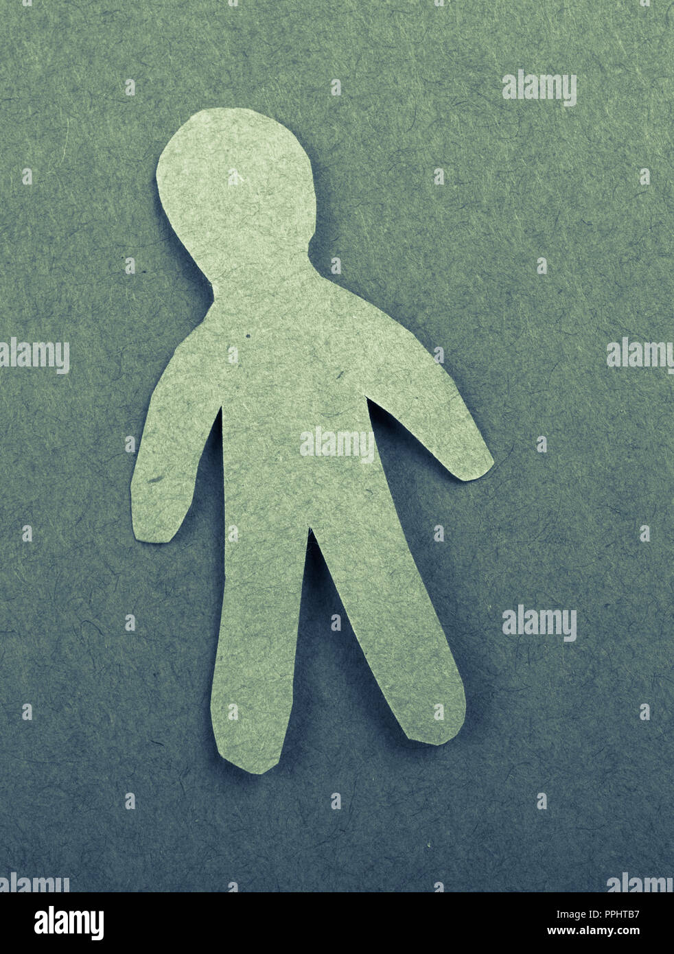Man shape cut out of paper in the view Stock Photo - Alamy