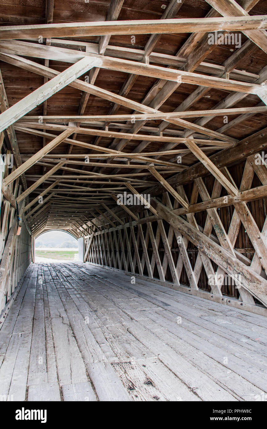 The interior latticework of the historic Hogback Covered Bridge ...
