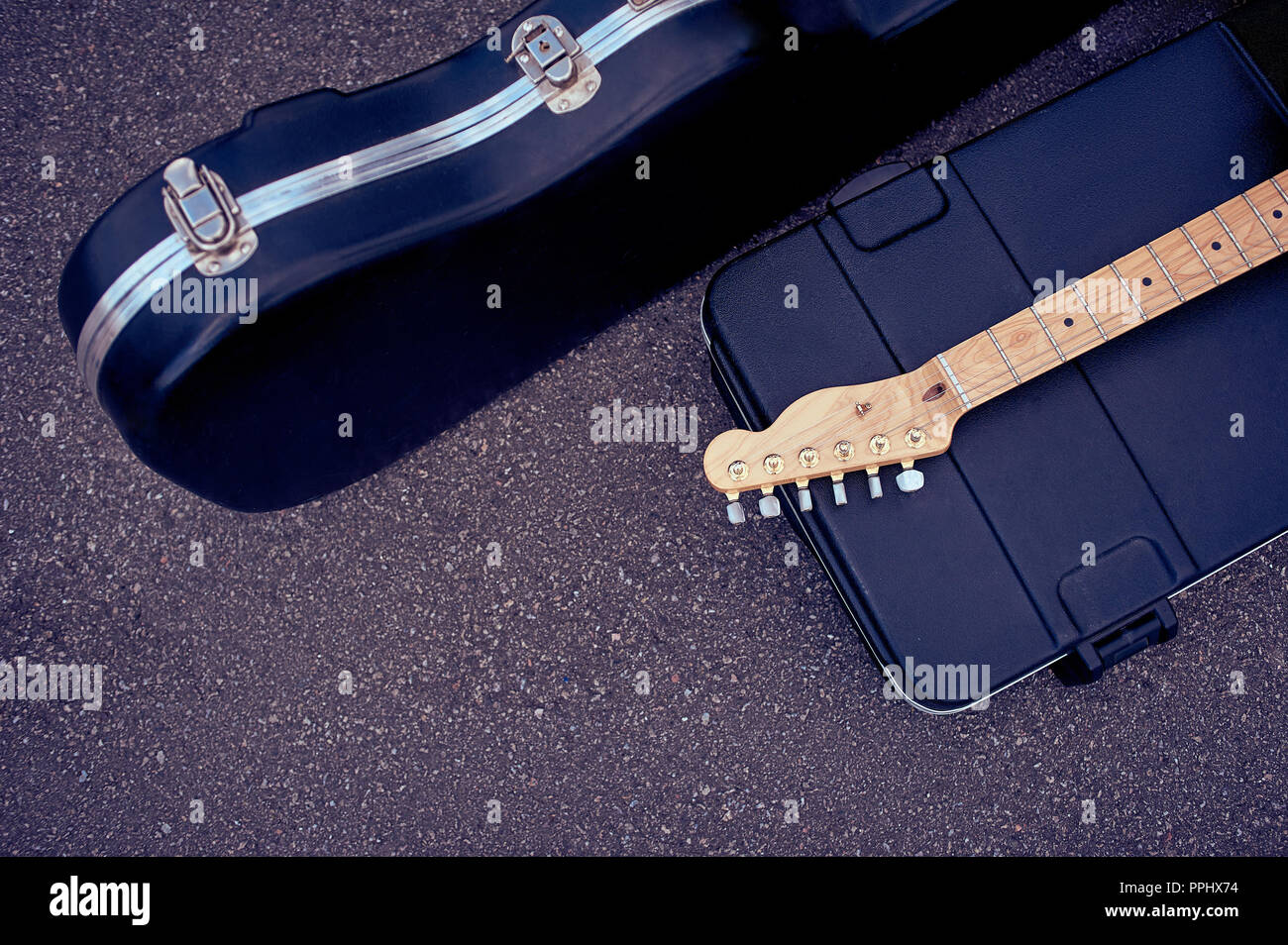 top view of musical instruments in cases lying on street Stock Photo ...