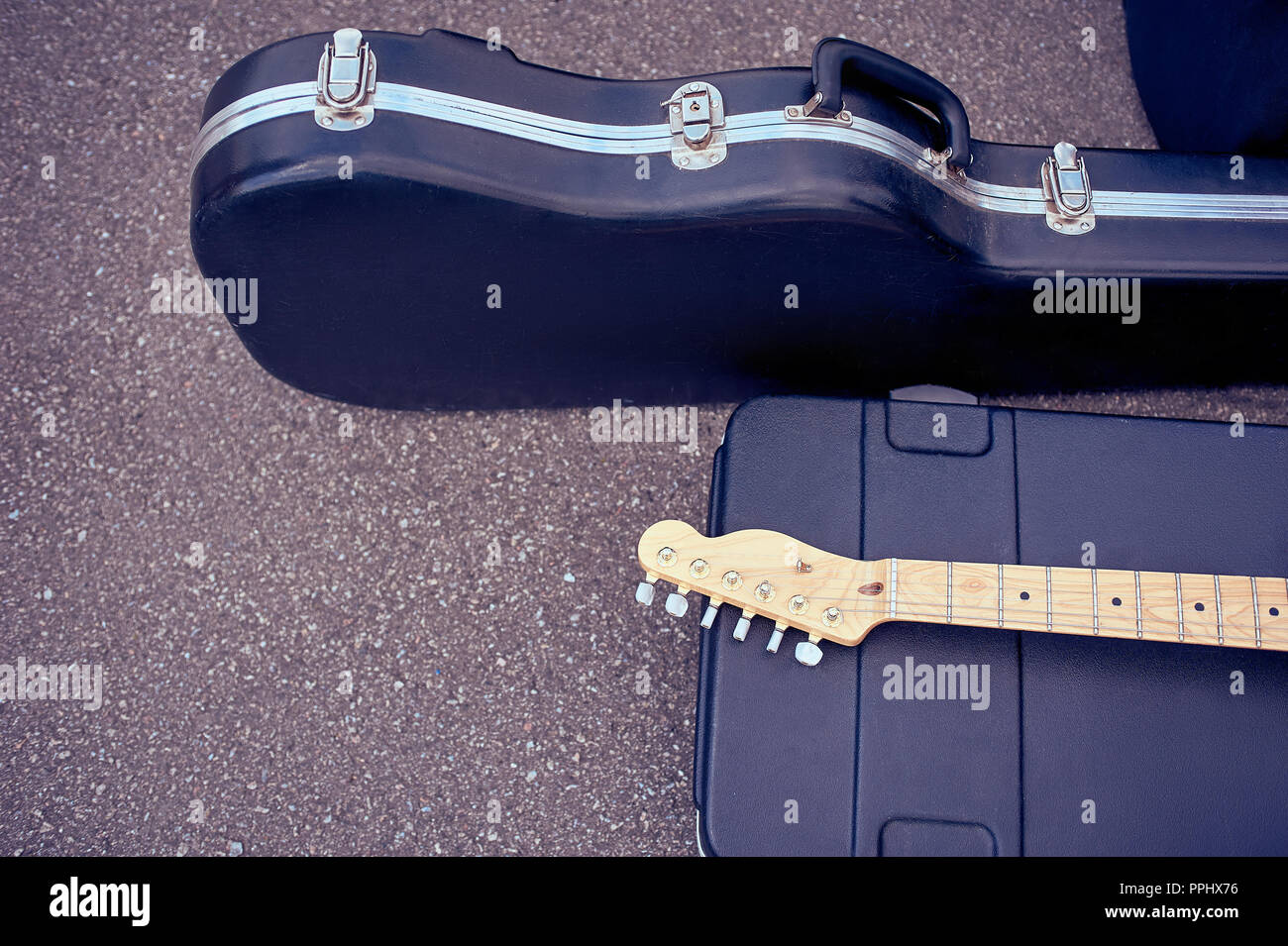 close up view of musical instruments in cases lying on street Stock ...