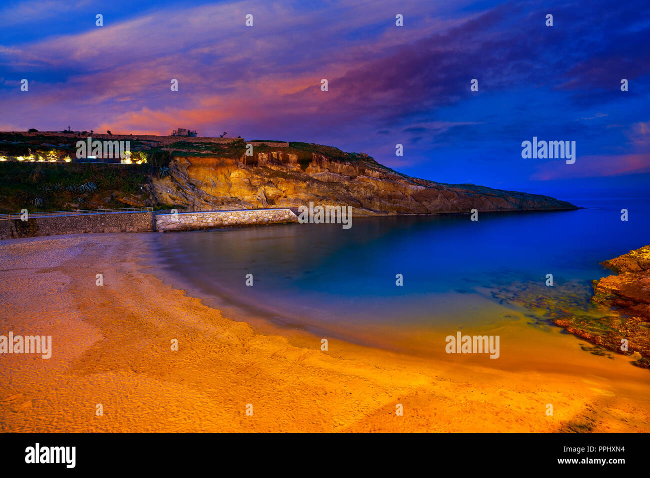 Llanes Playa del Sablon beach sunset in Asturias of Spain Stock Photo ...