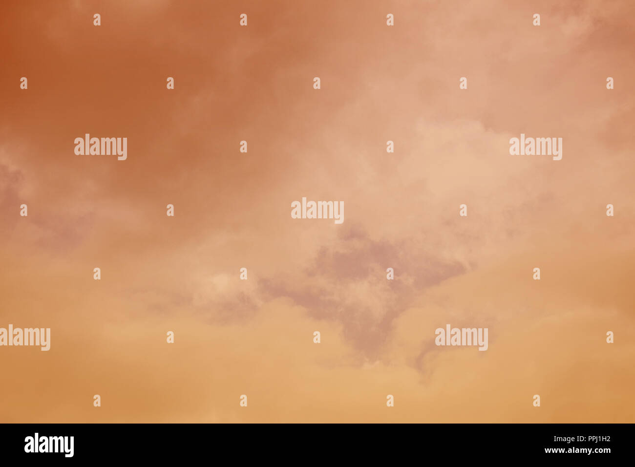 Nature background. Fluffy soft clouds in sky toned Stock Photo - Alamy