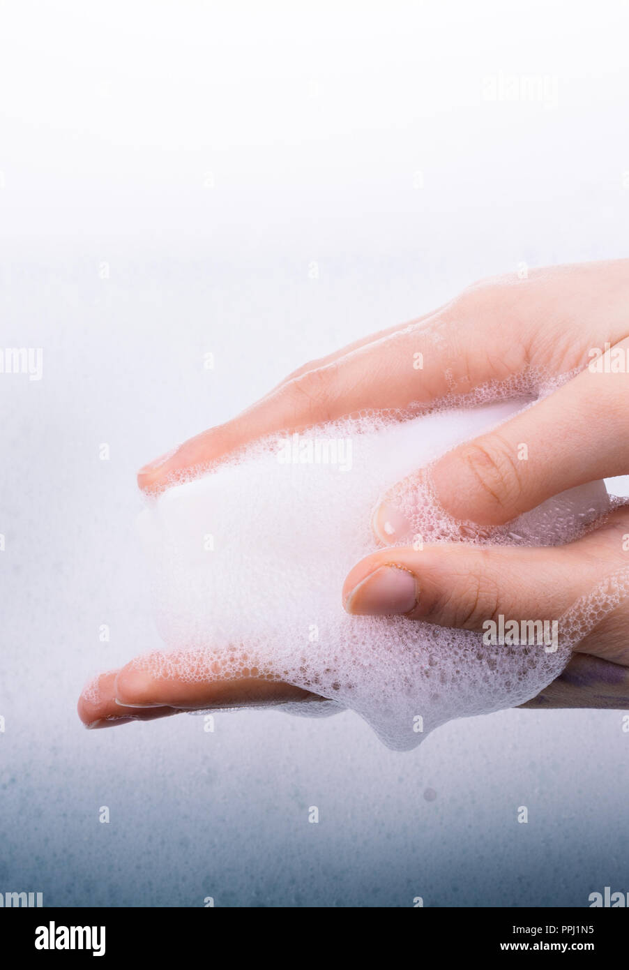 Hand washing and soap foam on a foamy background Stock Photo - Alamy