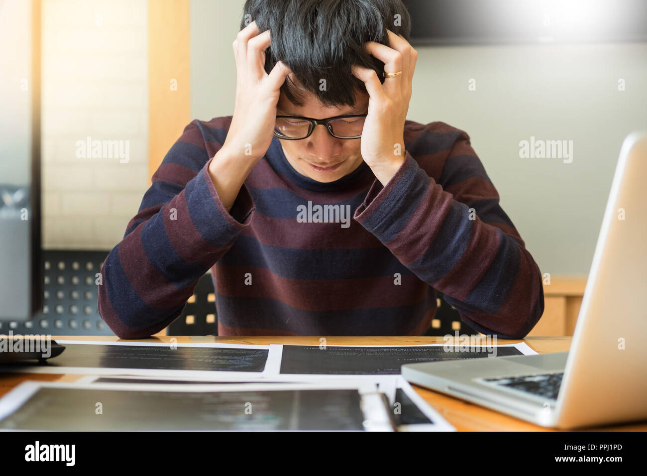 Young modern stressed programmer businessman a brake from working with ...