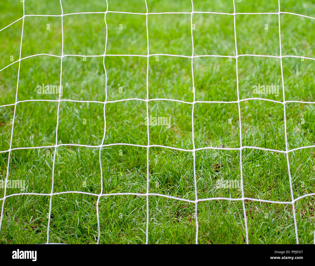 Seen through goal net hi-res stock photography and images - Alamy