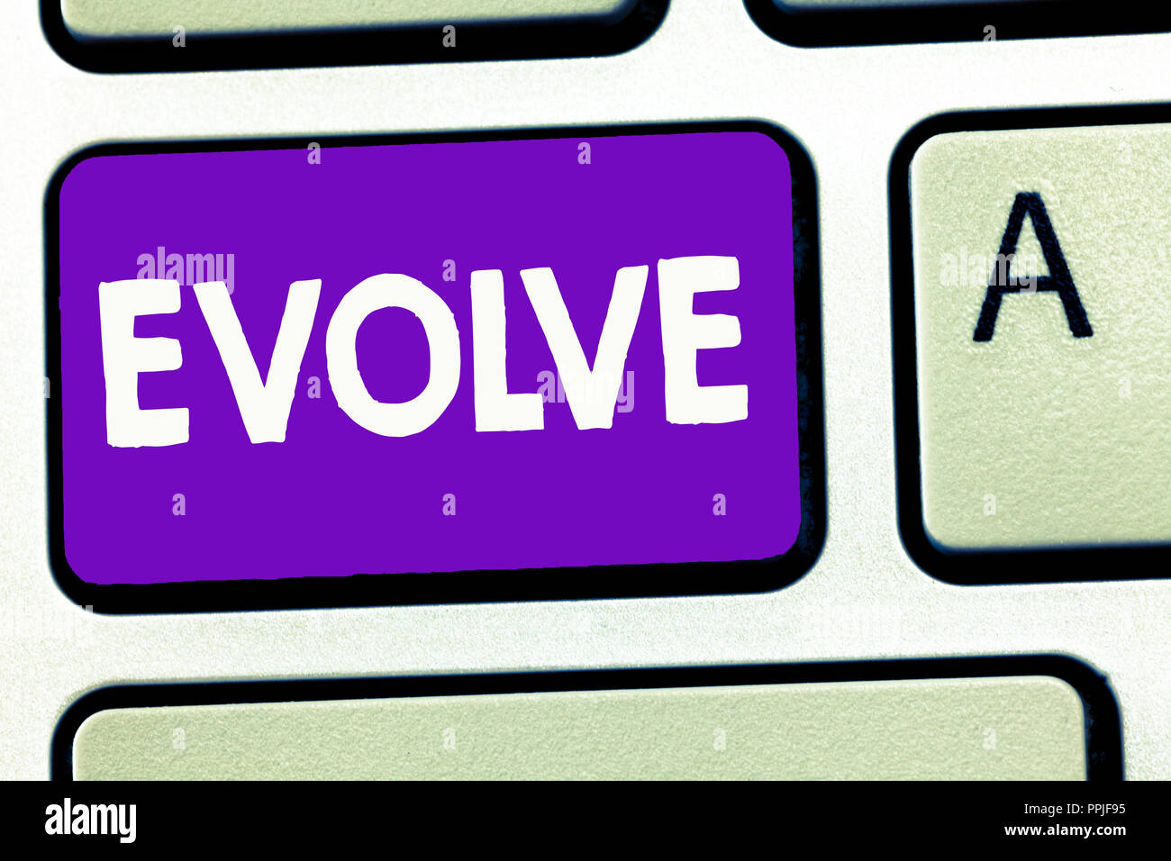 Handwriting text writing Evolve. Concept meaning develop gradually ...