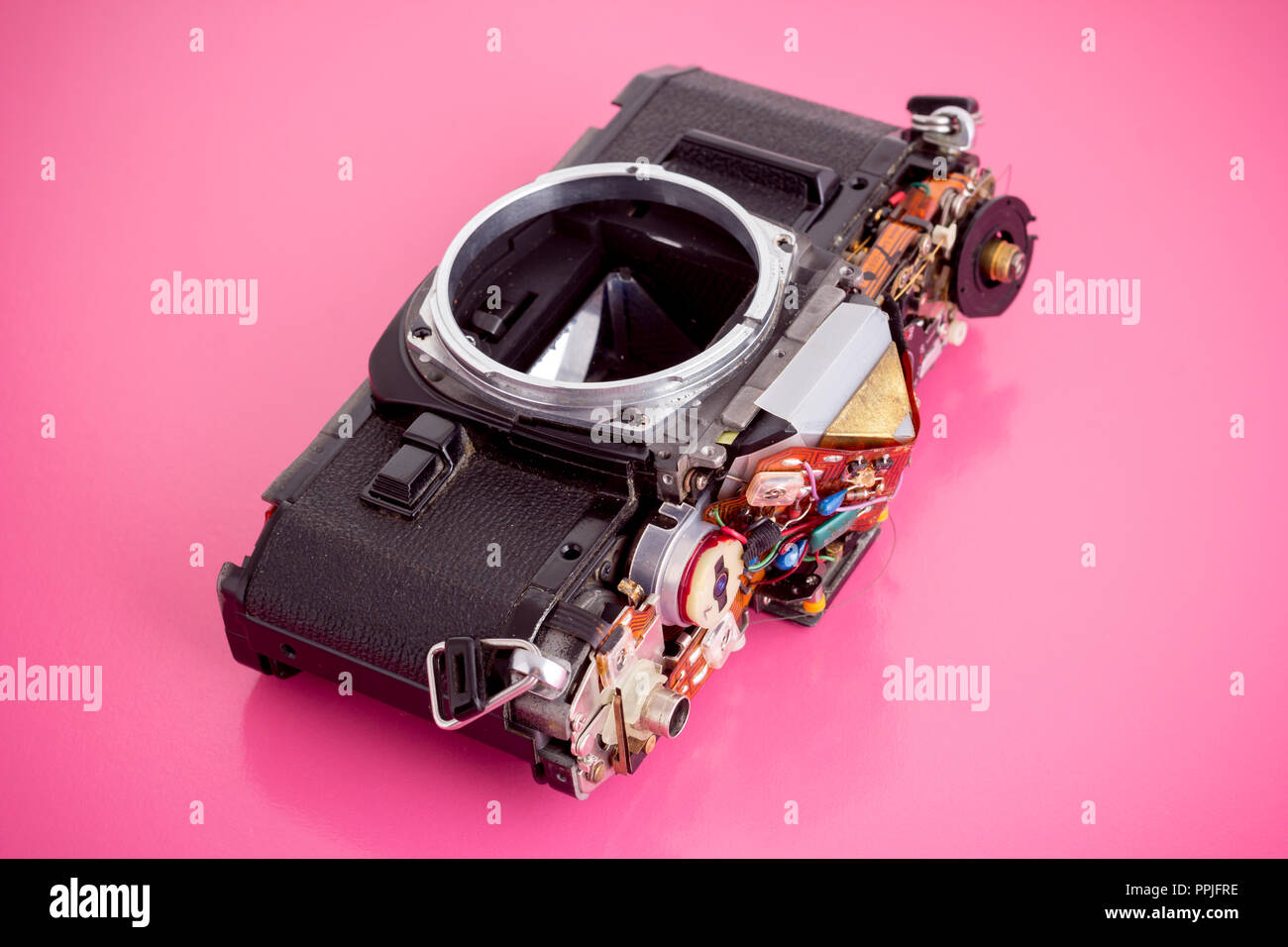 The old film camera washes out the parts on pink background Stock Photo ...