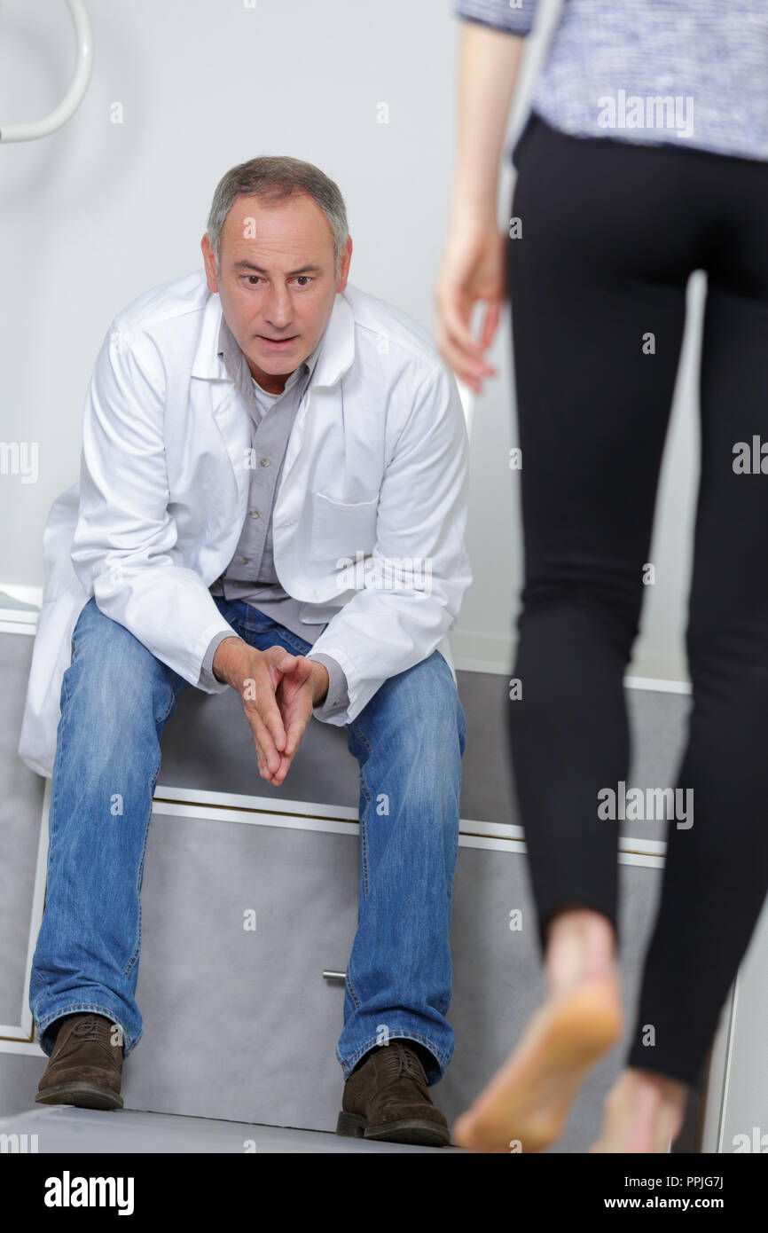 doctor observing the patients walk Stock Photo - Alamy