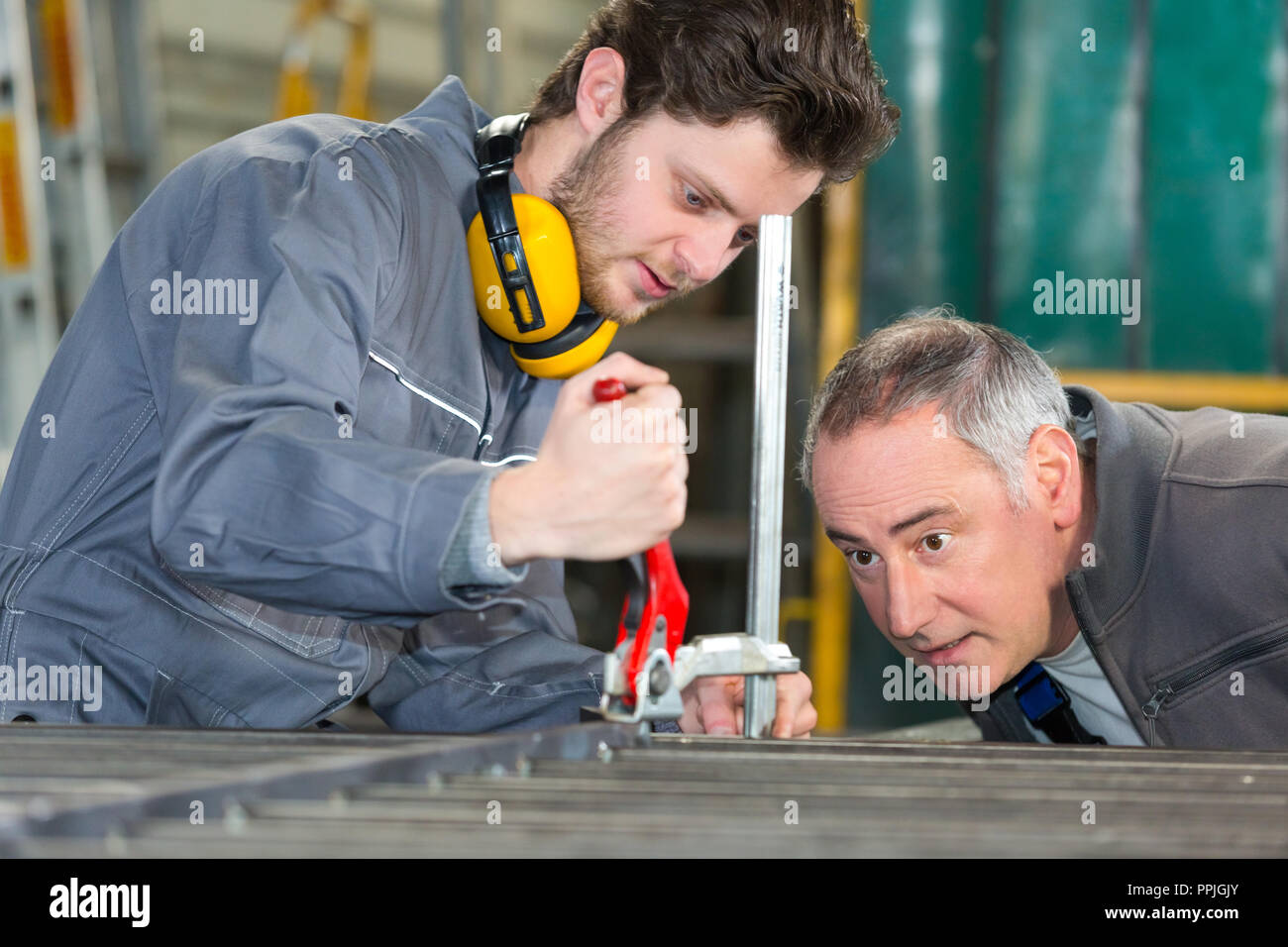young apprentice with professional metallurgist Stock Photo - Alamy