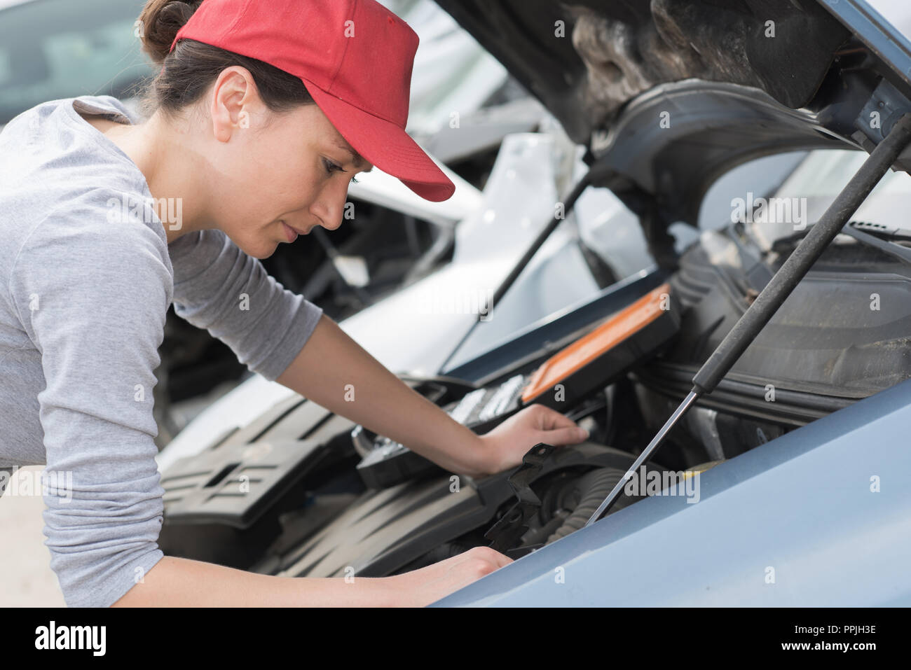 female mechanic fixing a car Stock Photo - Alamy