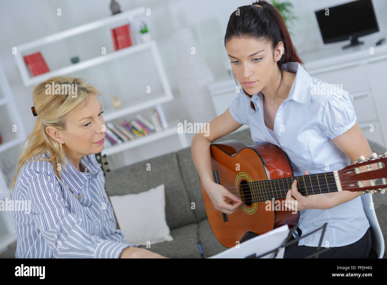 Female music teacher teenager hi-res stock photography and images - Alamy