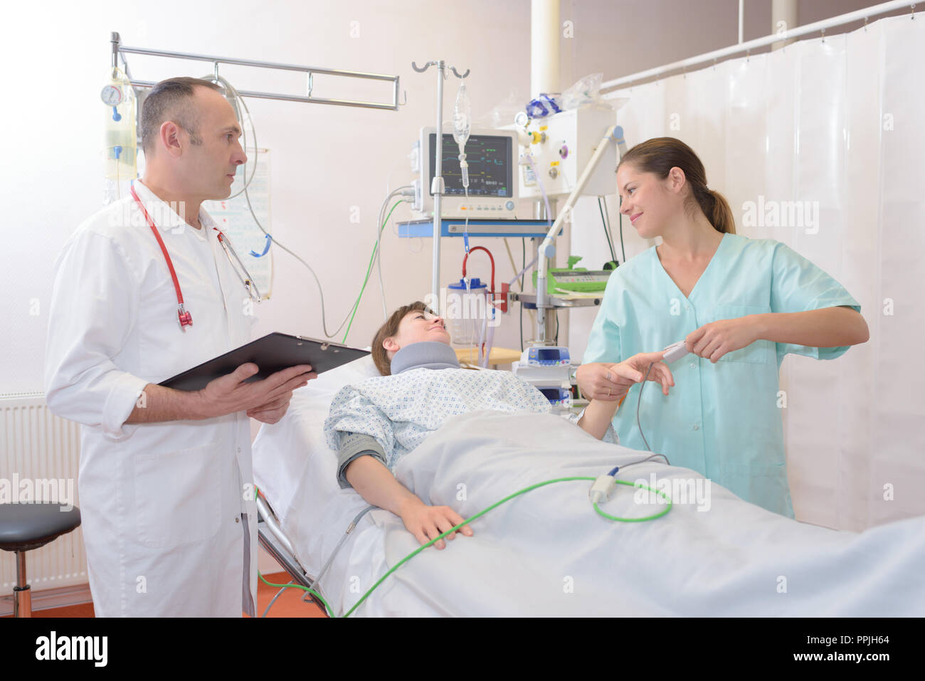 doctor showing positive test on tablet to sick man Stock Photo - Alamy