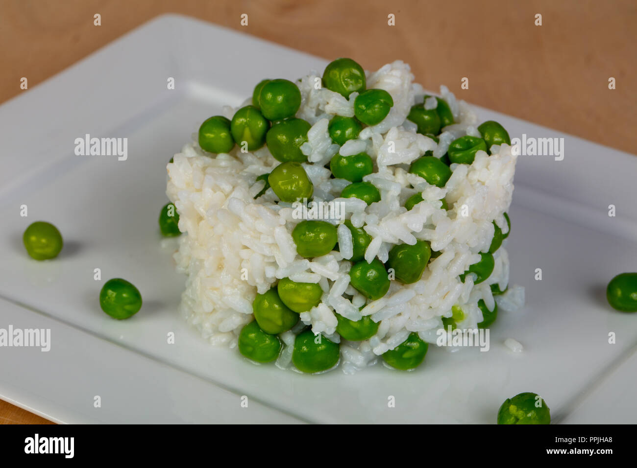 Steamed rice with green peas in the plate Stock Photo - Alamy