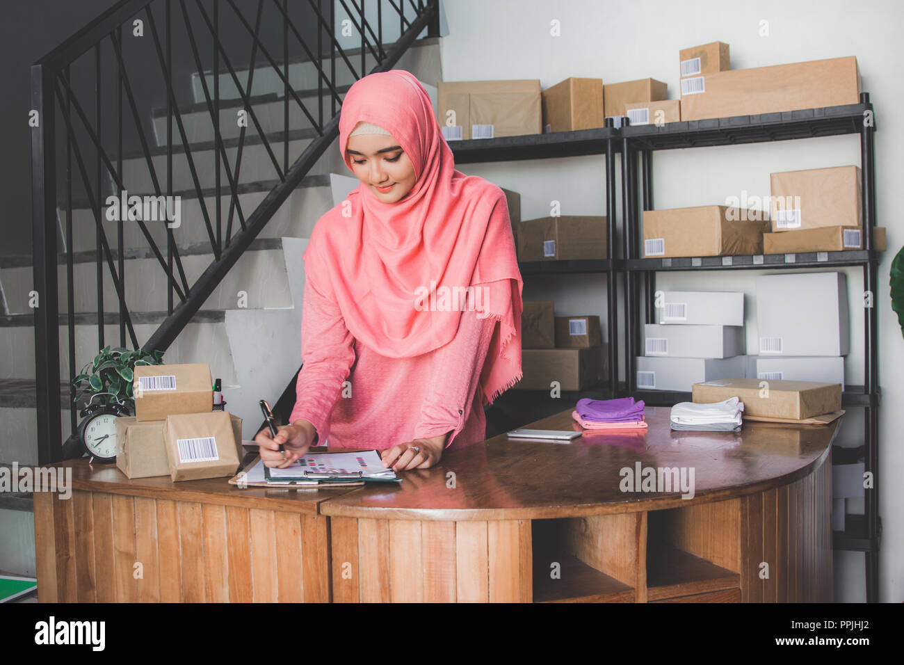 Female muslim shop assistant hi-res stock photography and images - Alamy