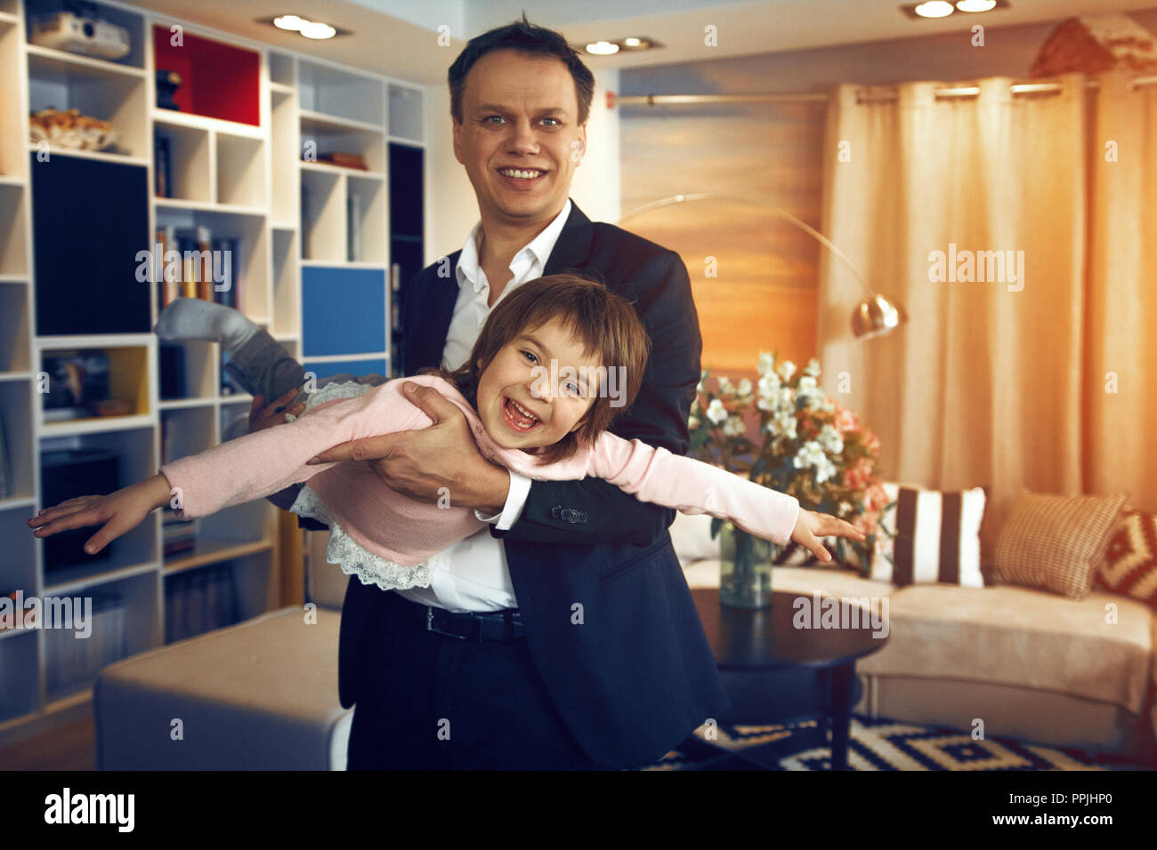 Father businessman plays with daughter Stock Photo - Alamy