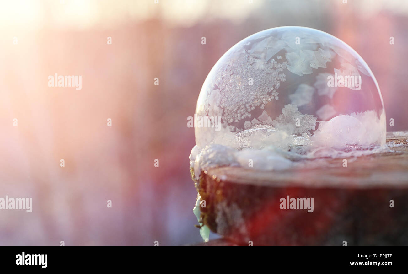 Soap bubbles freeze in the cold. Winter soapy water freezes in t Stock ...