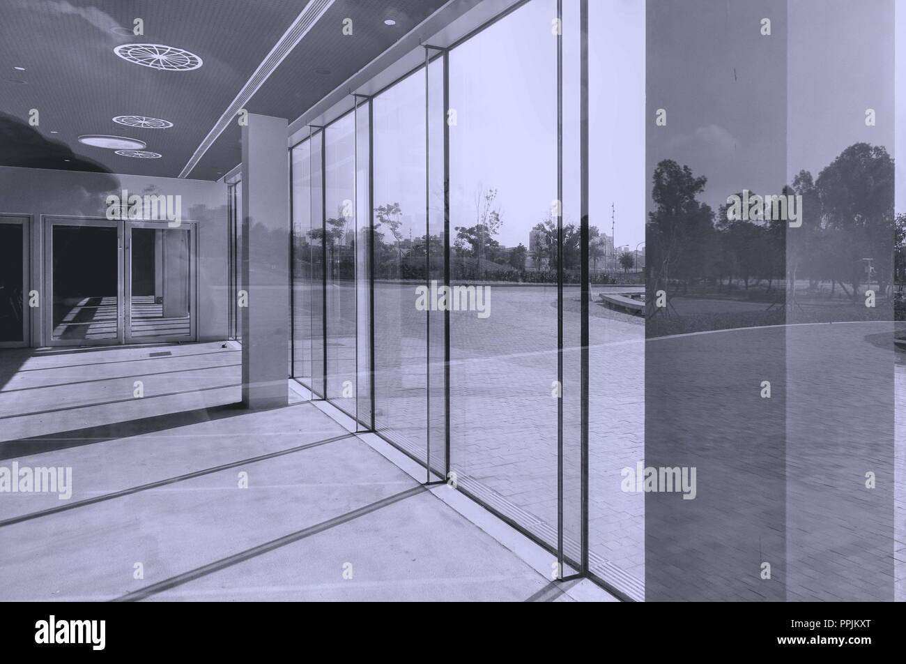 Architectural detail with glass, reflections, sunlight and shadows ...