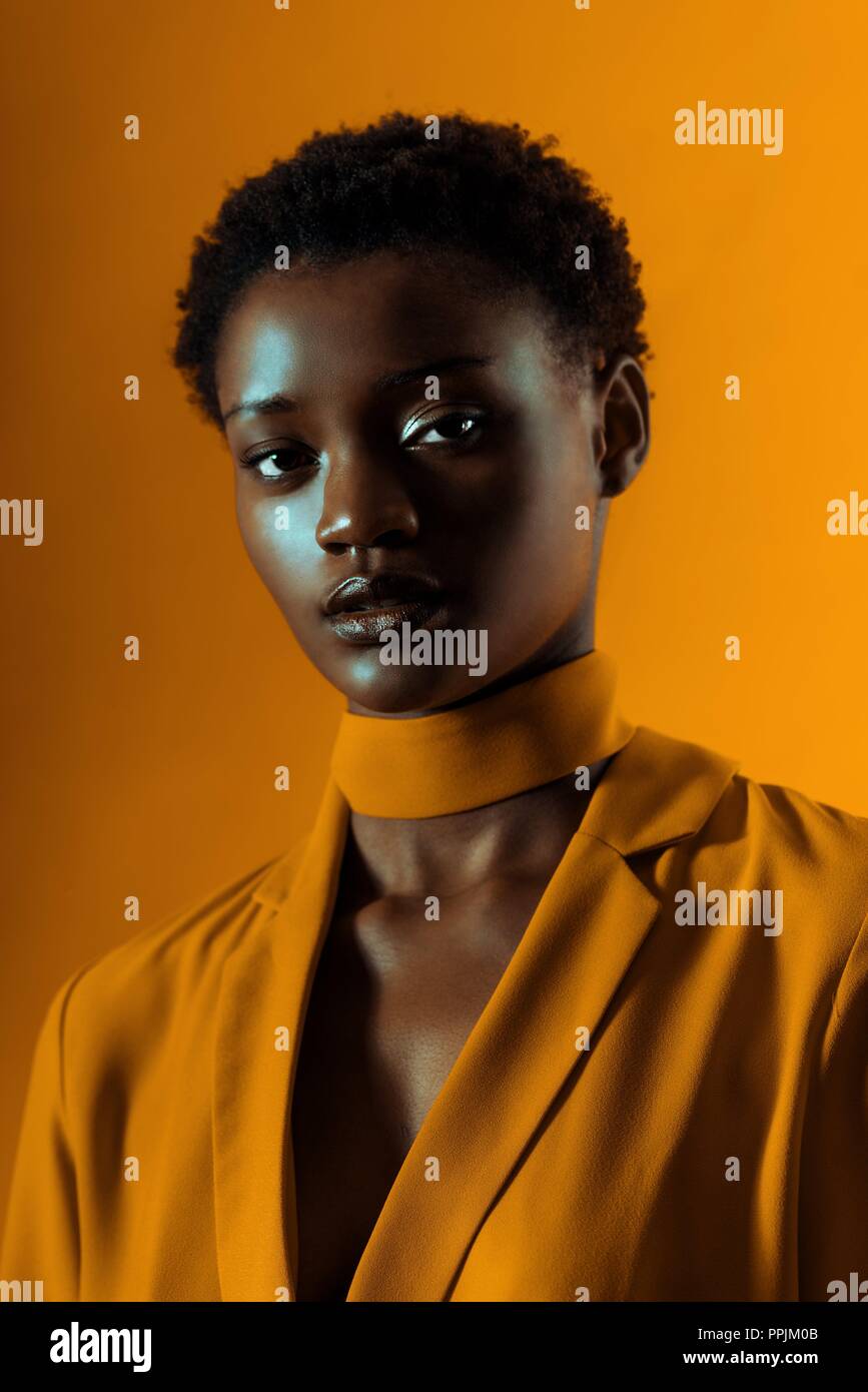 Model In Gold Fashion PhotoGold outfit being worn by a female fashion ...