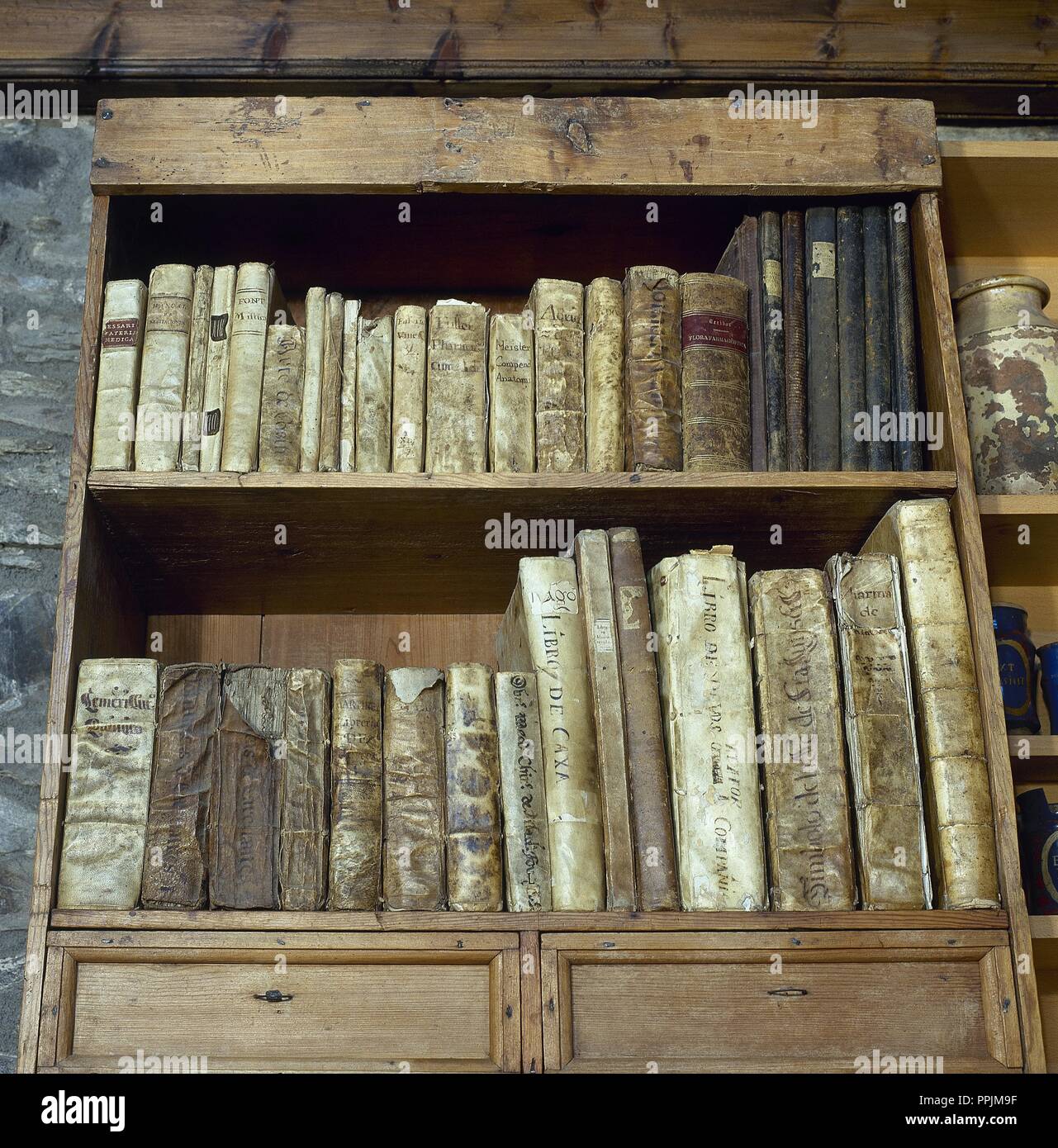 HISTORY OF THE PHARMACY. SHELVES WITH OLD BOOKS of medicine, medicinal ...