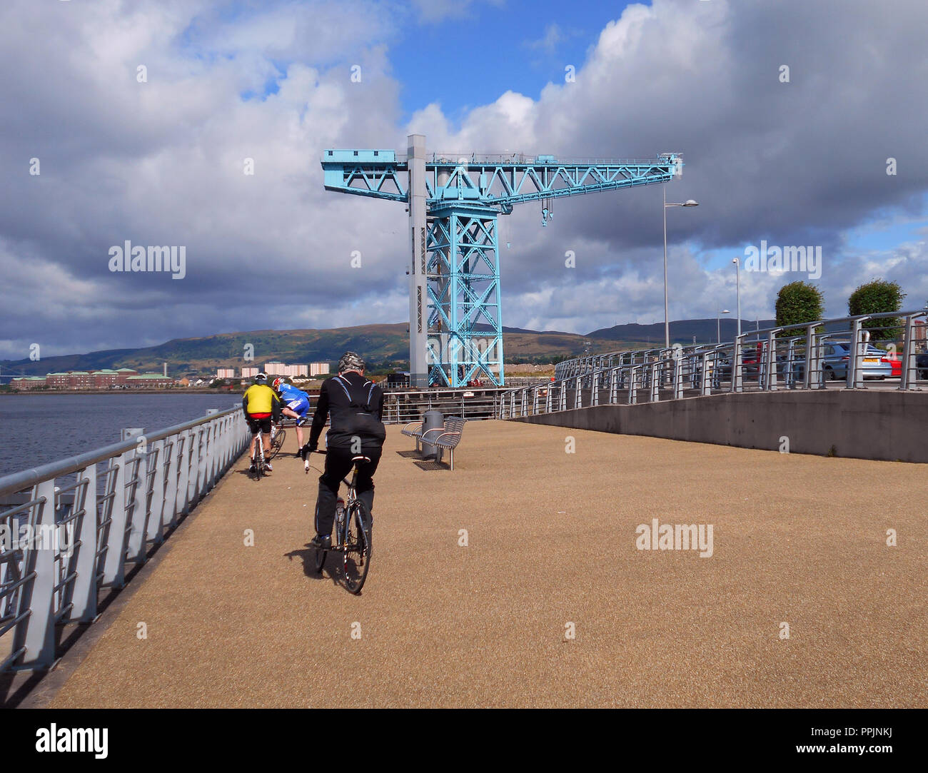 Cyclists on the cycle path and walkway that runs alongside the River ...