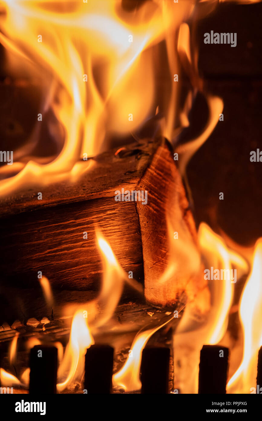 Hardwood logs on fire inside a woodburning stove Stock Photo - Alamy