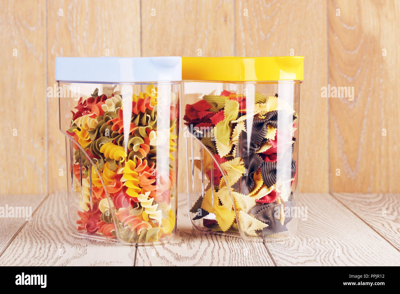 raw fancy pasta of different color in plastic containers Stock Photo ...