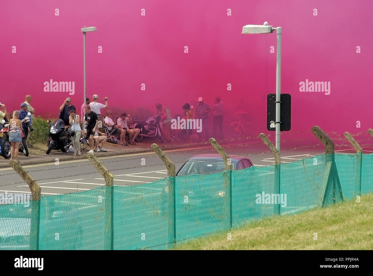 Thick red and blue coloured smoke (giving purple hue) and jet wash from ...