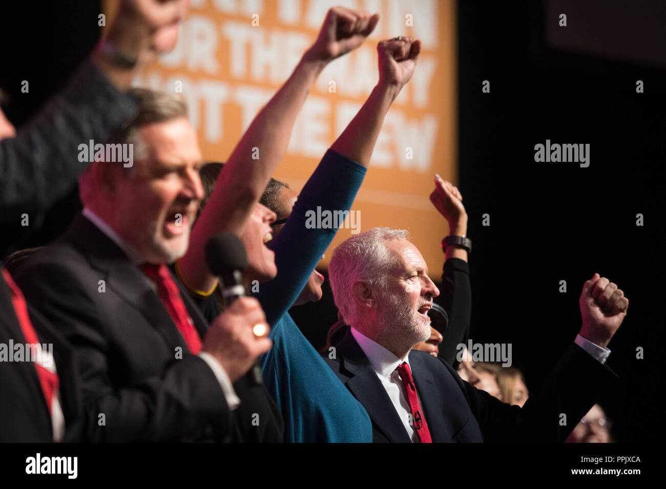 Labour leader Jeremy Corbyn is joined on stage by supporters (including ...