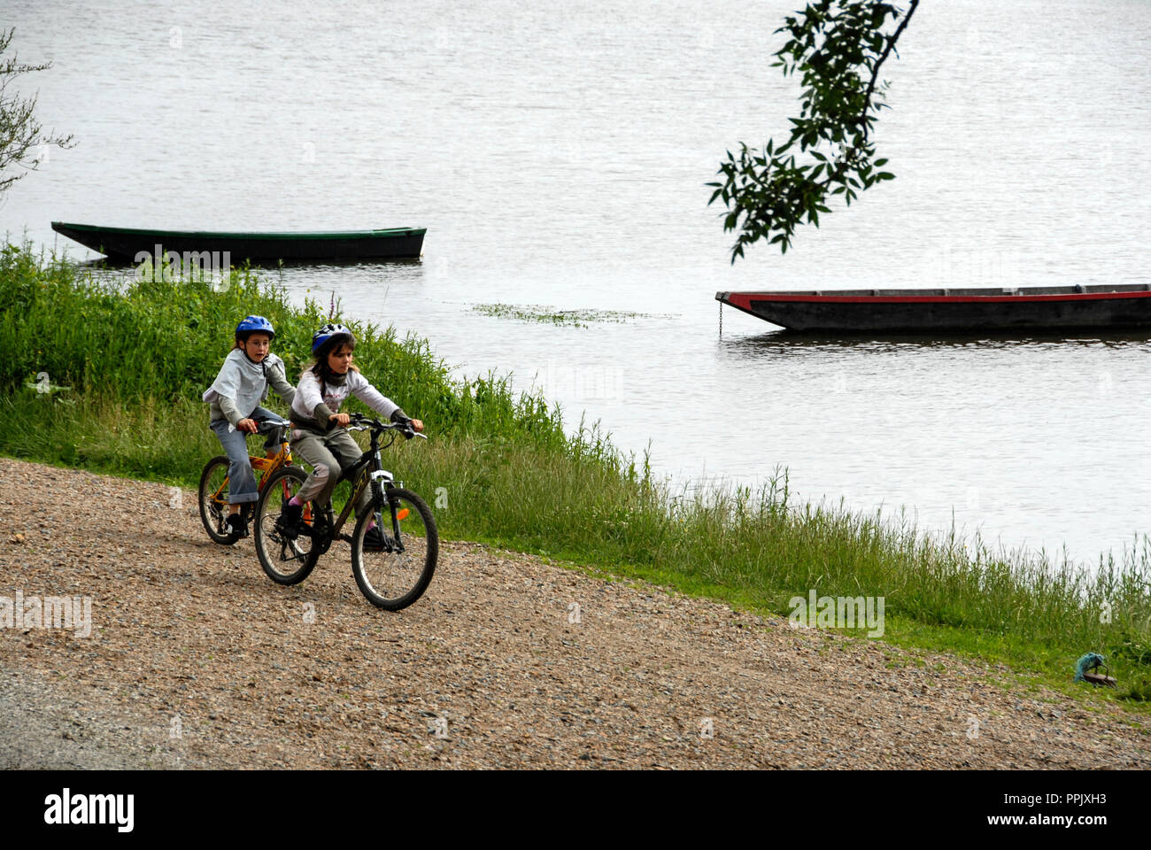 Children riding their bike along a cycle path. Cycling is growing ...