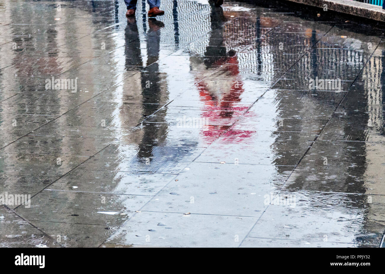 Raining in London, UK. Reflections on wet pavement, sidewalk Stock ...