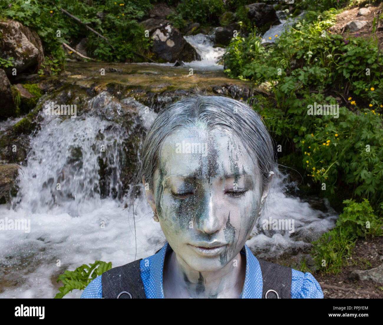 Girl Office worker, outdoors with a makeup on her face imitating a ...