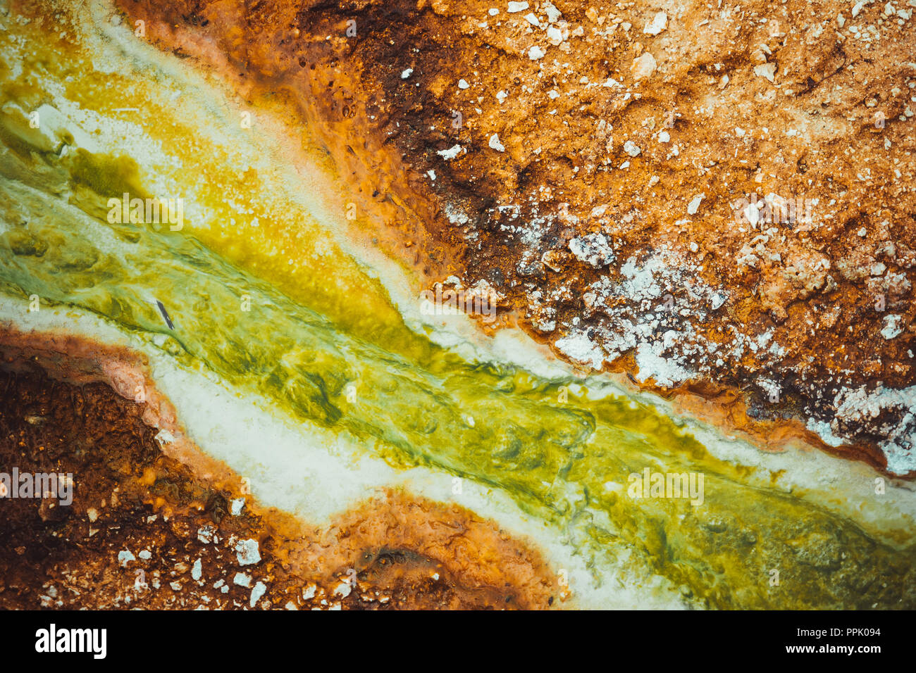 Close up photo showing texture and natural colors of a geyser thermal ...