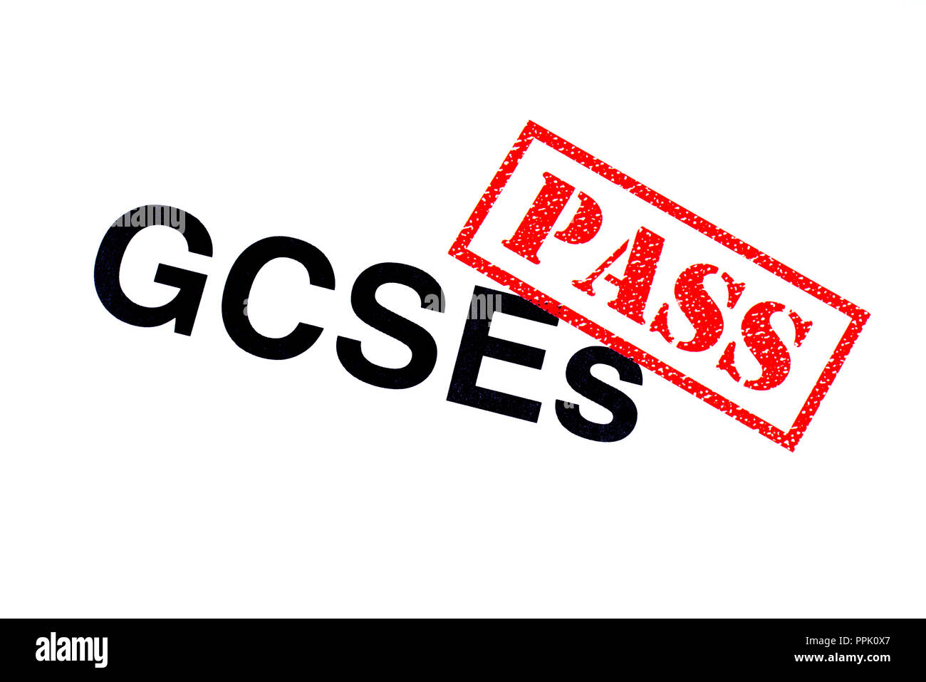 A GCSEs heading stamped with a red PASS rubber stamp Stock Photo - Alamy