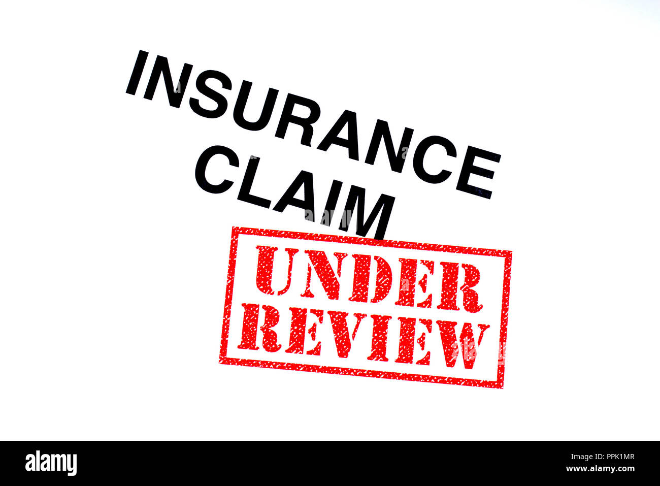 Insurance Claim heading stamped with a red UNDER REVIEW rubber stamp ...