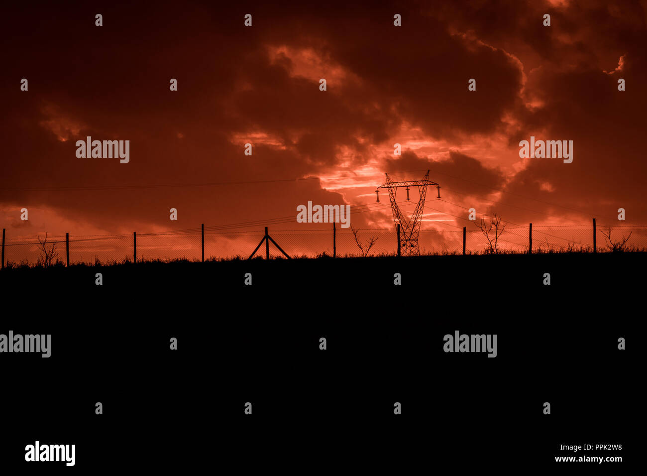 Cinematic horror scenario, deep red sky, with massive black clouds ...