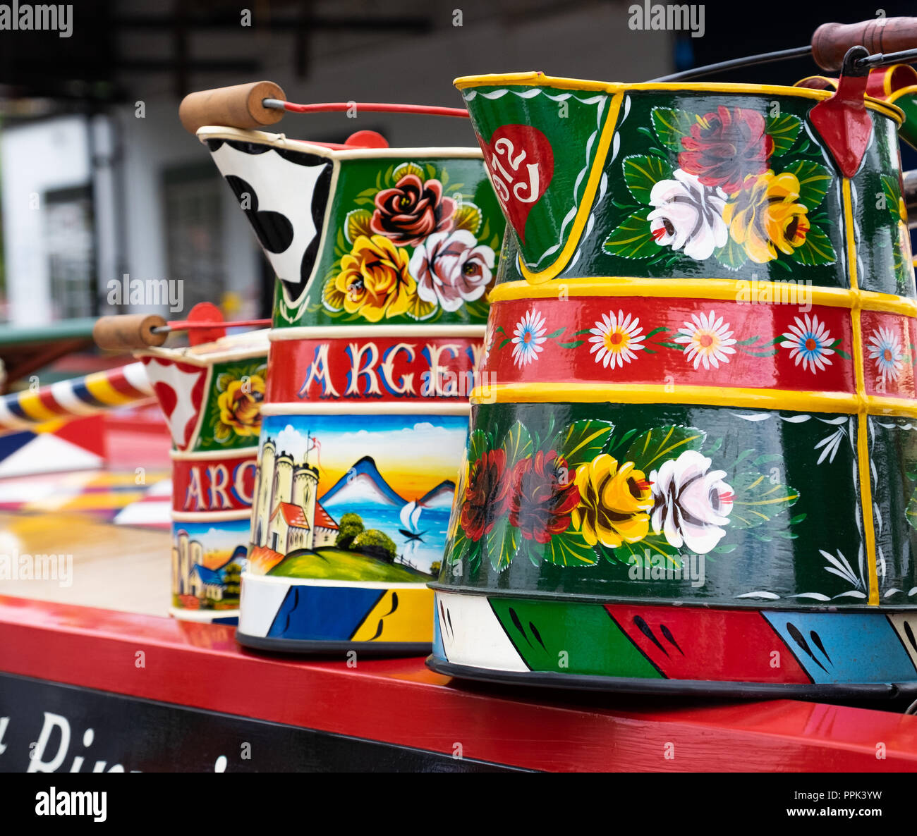 Hand painted, brightly coloured canal art jugs featuring names, flowers ...