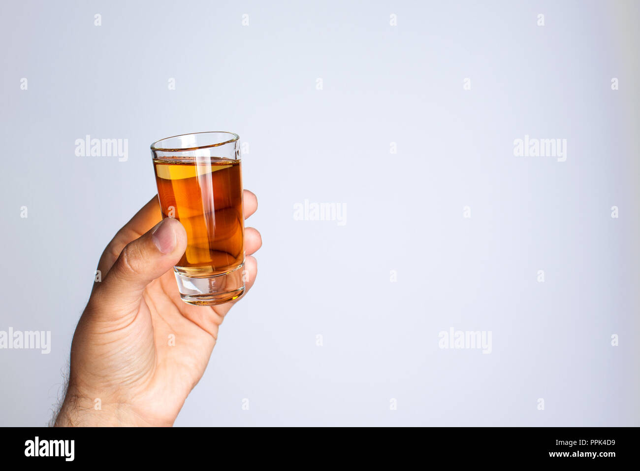 Hand with glass cheers hi-res stock photography and images - Alamy