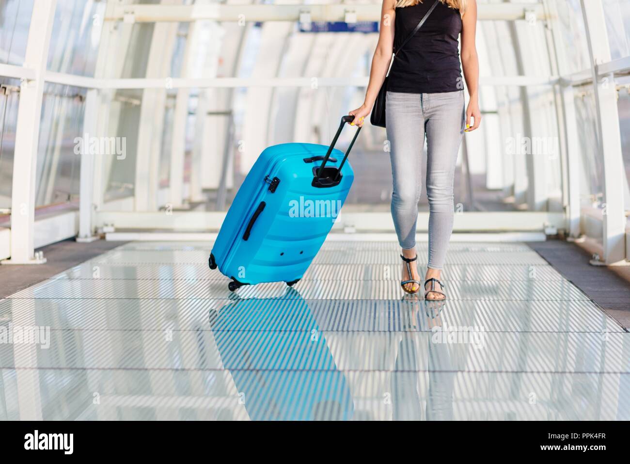Woman with her baggage on airport terminal. Business trip Stock Photo ...