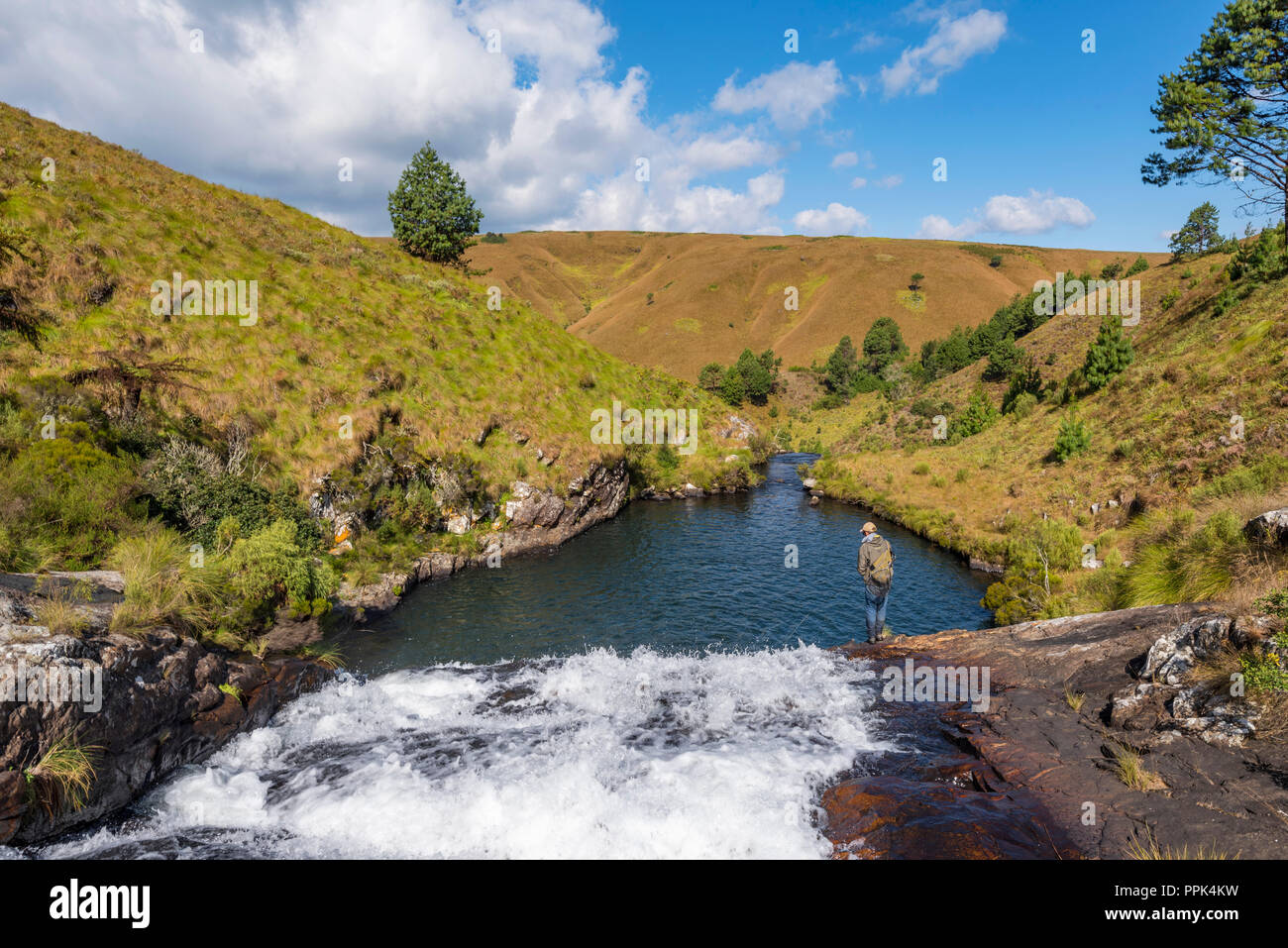 A fly fisherman plies the wild rivers of Nyanga National Park in ...