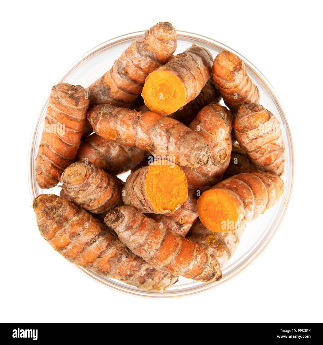 Turmeric root in glass bowl isolated on white, viewed from above Stock ...