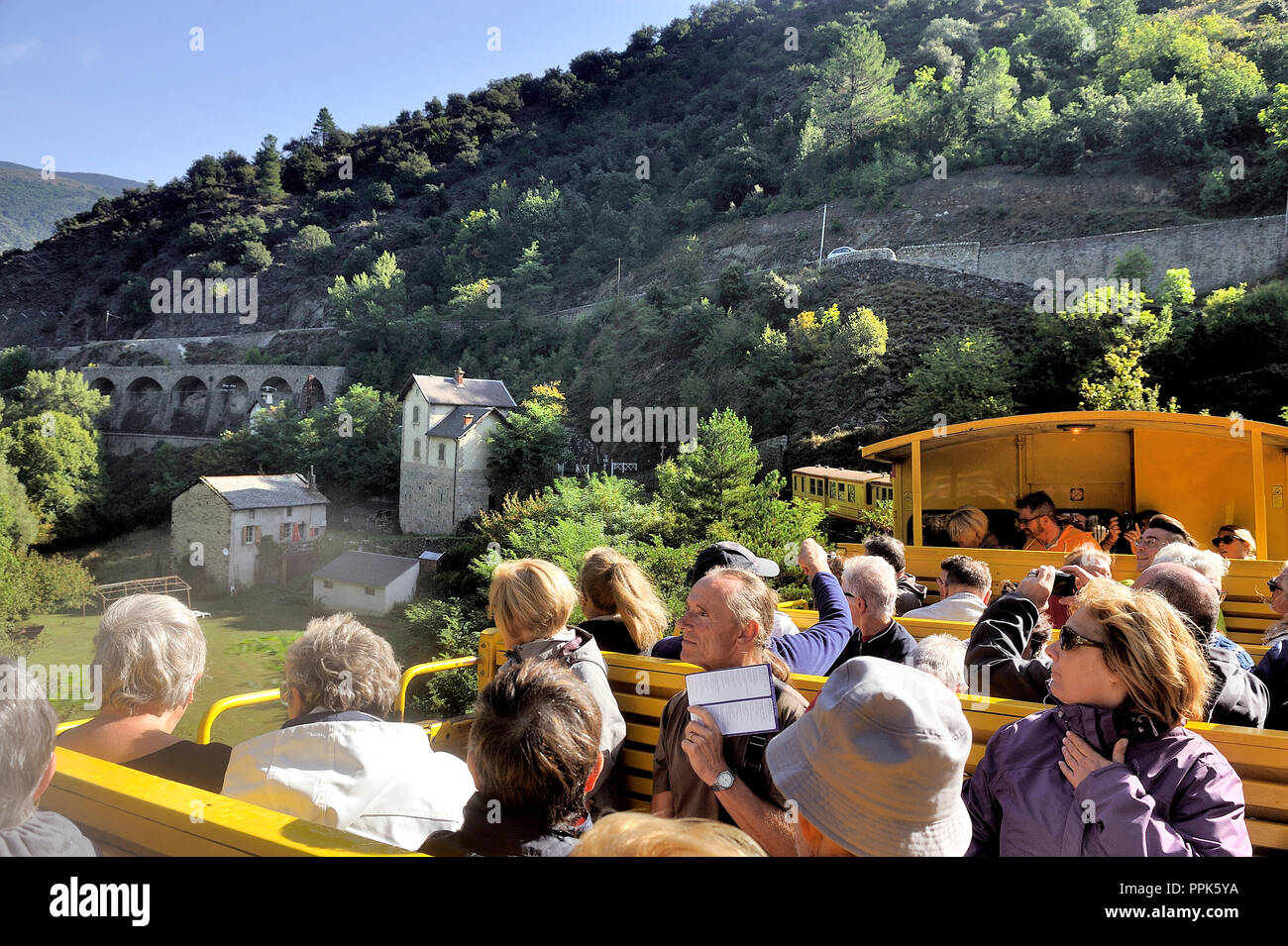 The little yellow train of the Pyrenees Crossing mountain landscapes ...