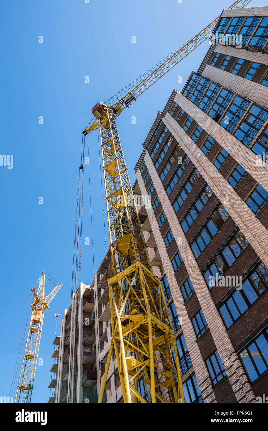 Construction of a high-rise building with a crane. Building ...