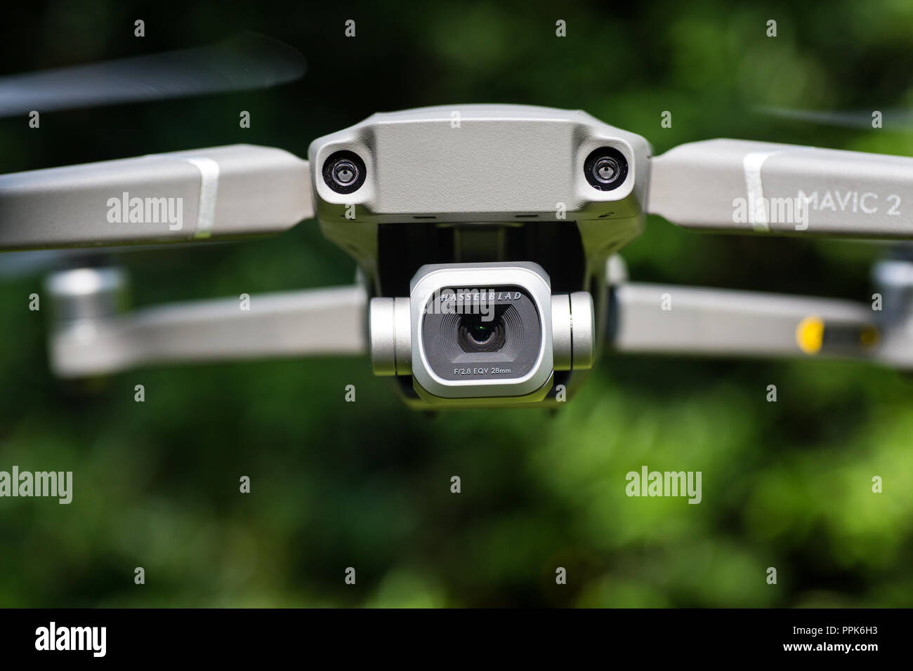 Close up view of Mavic 2 pro front camera, the drone is hovering on air ...