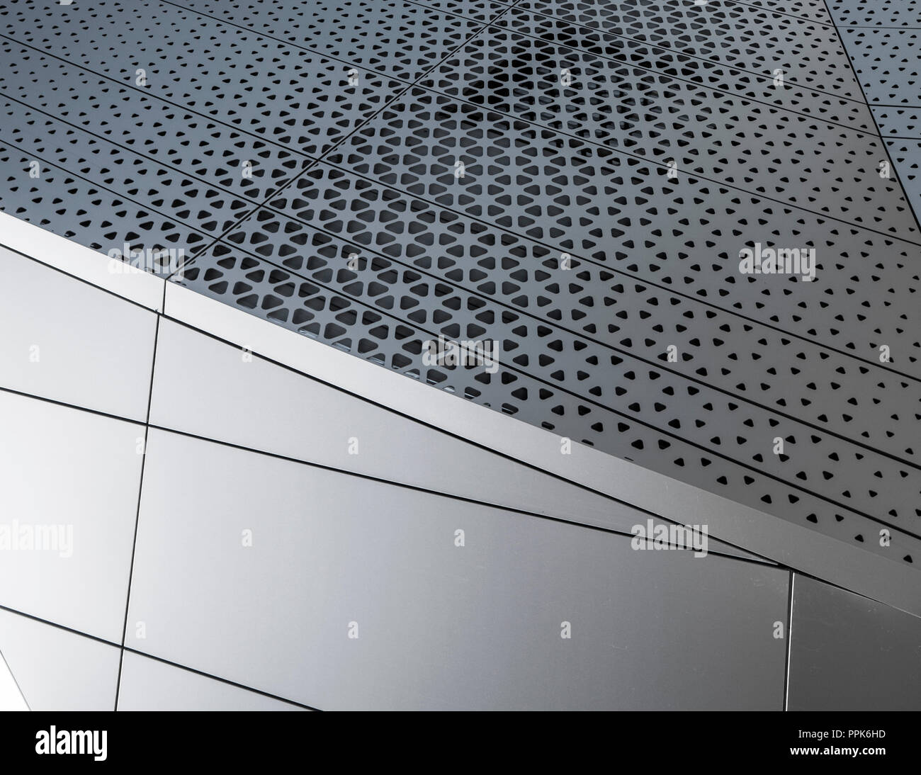 Building with white aluminum facade and aluminum panels Stock Photo - Alamy